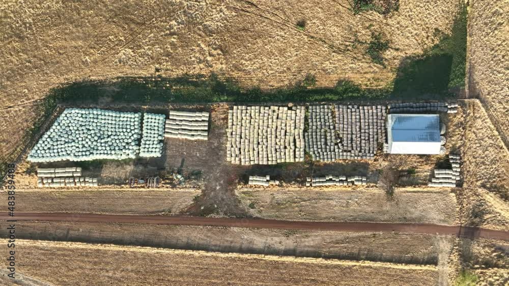 Top down footage of a hay and silage stack yard on a farm in victoria ...