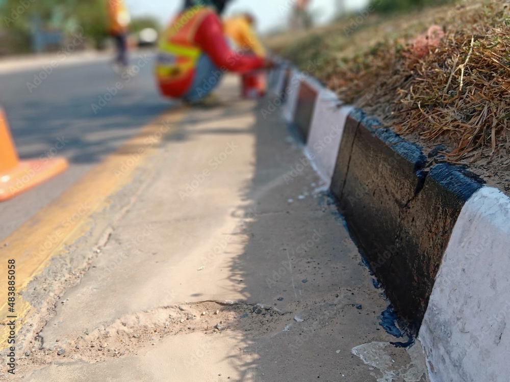 paint job concrete barrier curb and gutter Stock Photo | Adobe Stock