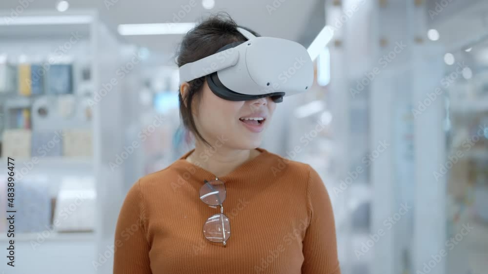 Exciting asian female wearing vr headset getting experience using VR ...