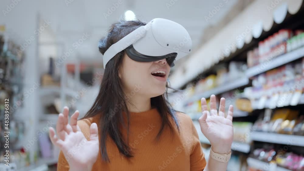 Exciting asian female wearing vr headset getting experience using VR ...