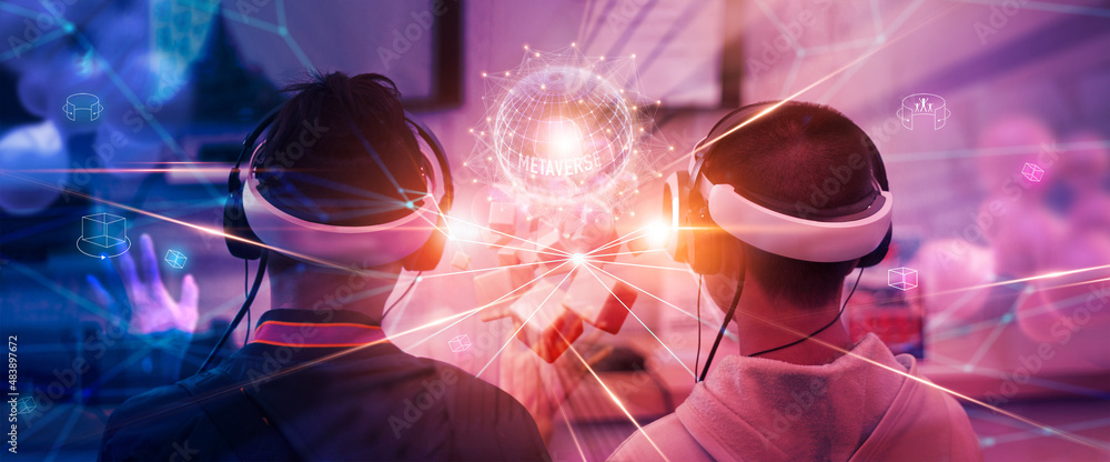 Metaverse Technology concepts. Two teenager play VR virtual reality goggle and experiences of ...