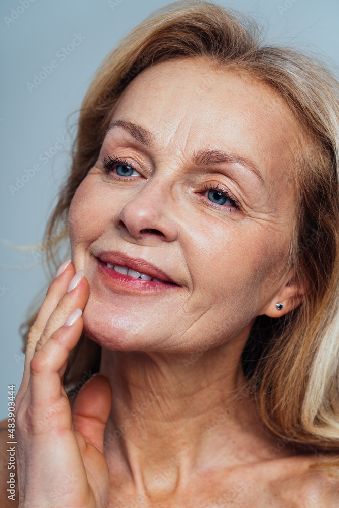 Cincematic image of a beautiful senior woman posing on a beauty photo ...
