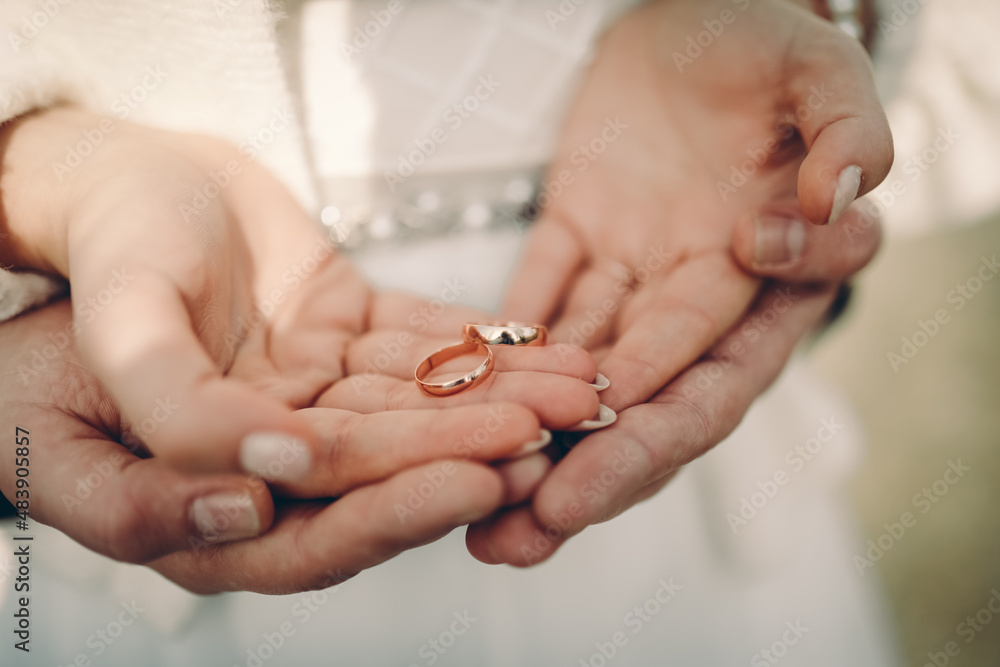 wedding rings on hands of bride Stock Photo | Adobe Stock