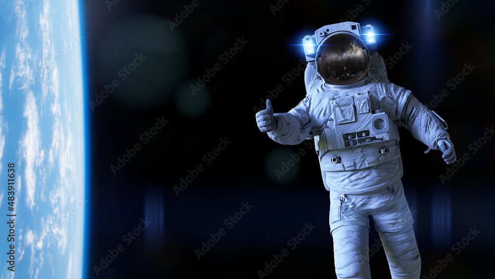 astronaut showing a thumbs up during space walk in Earth orbit ...