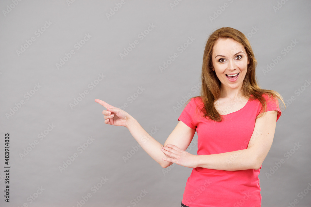 Woman pointing, surprised face expression Stock Photo | Adobe Stock