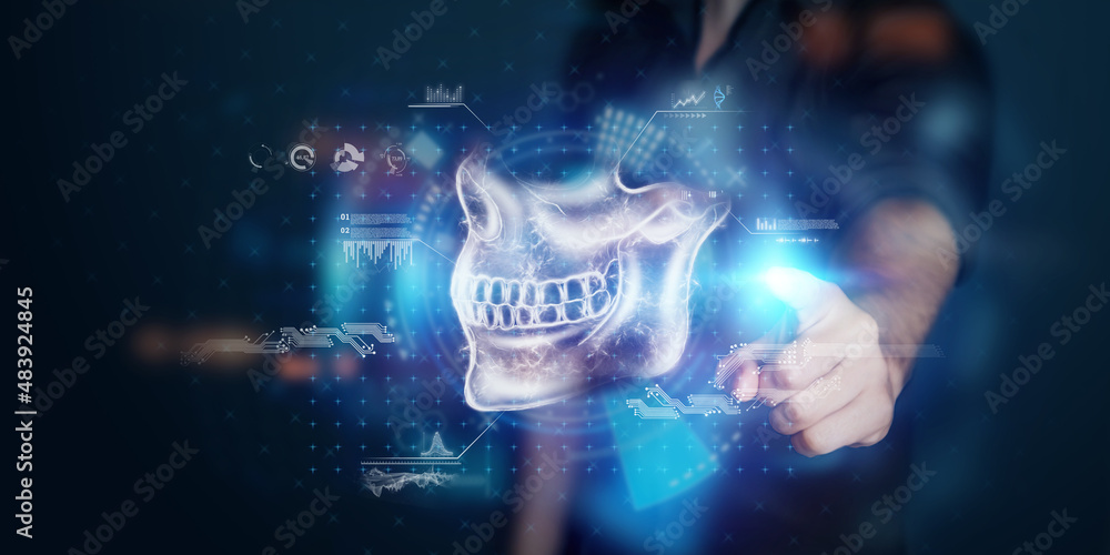 A man looks at the hologram of the jaw, 3D x-ray of the skull. Modern ...