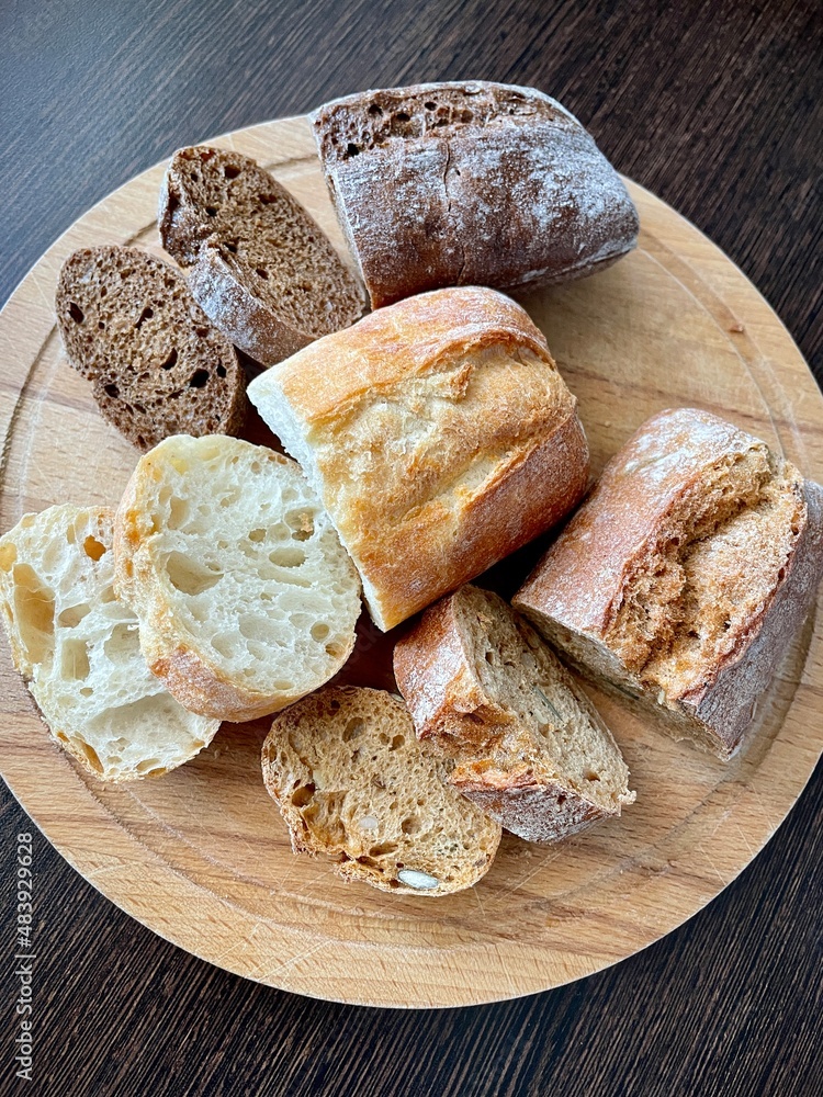 Foto de large vertical photo. three types of bread rolls cut into ...