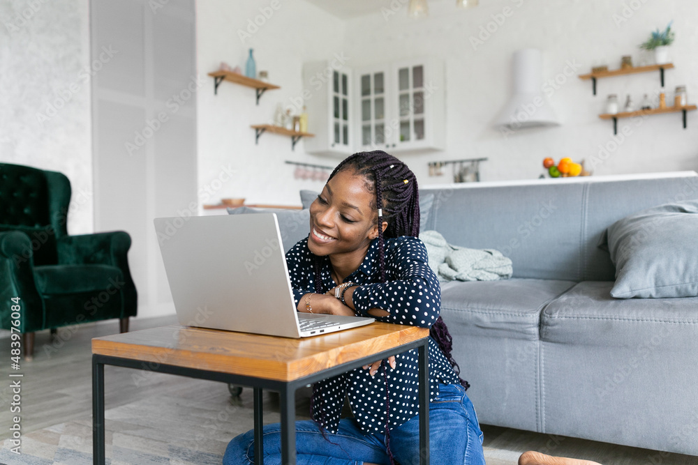 Beautiful young black woman has a zoom call remote work or study online ...