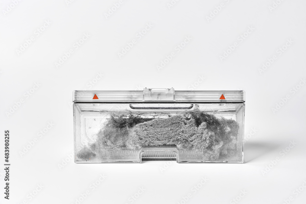 Transparent dust container of the robot vacuum cleaner after cleaning ...