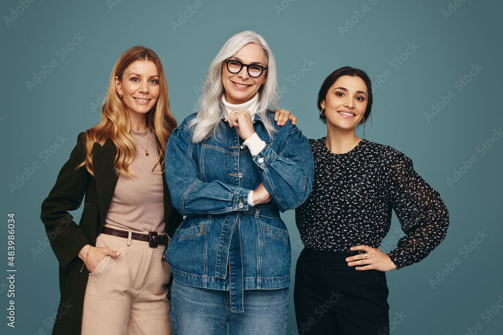 Three generation women standing together in a studio Stock Photo ...