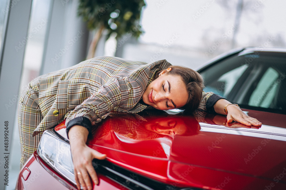 Beautiful woman hugging a car Stock Photo | Adobe Stock