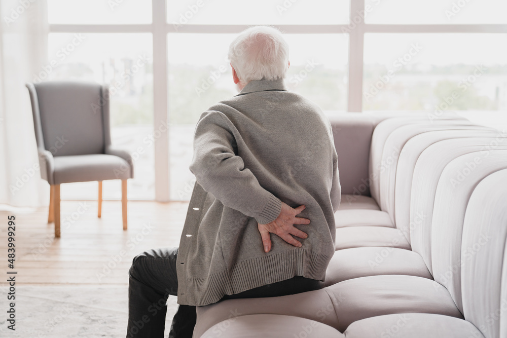 Senior old elderly man grandfather touching his back, suffering from ...