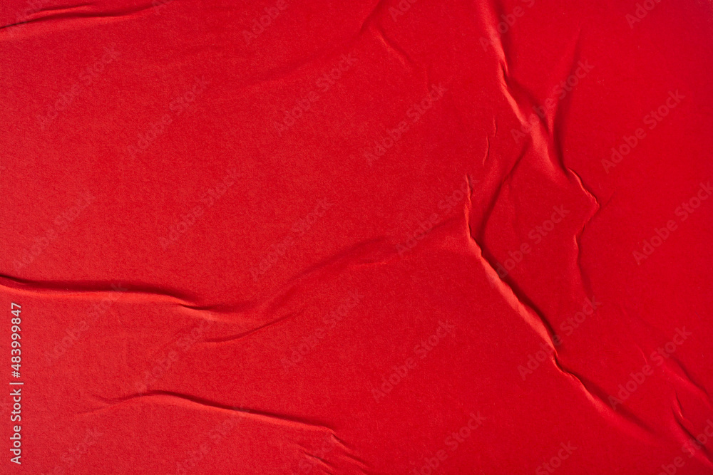 Sheet of red paper with folds. Stock Photo | Adobe Stock