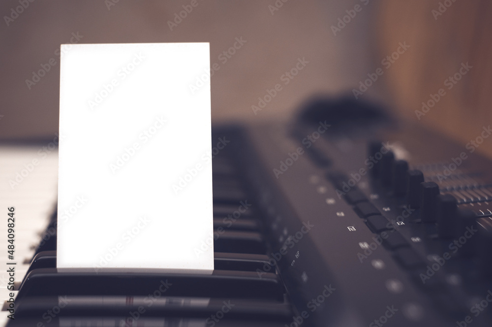 Mockup of a business card that sticks out in a synthesizer or midi ...