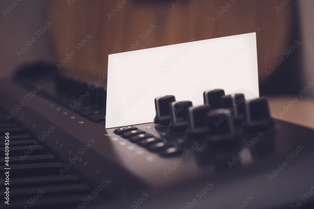 Mockup of a business card that sticks out in a synthesizer or midi ...