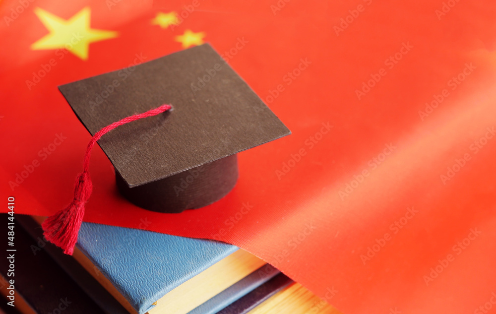 Graduation cap on Chinese flag. Language learning. China student ...