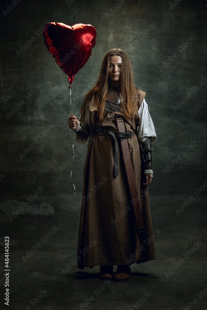 Full-length portrait of sad beautiful woman in image of medieval ...