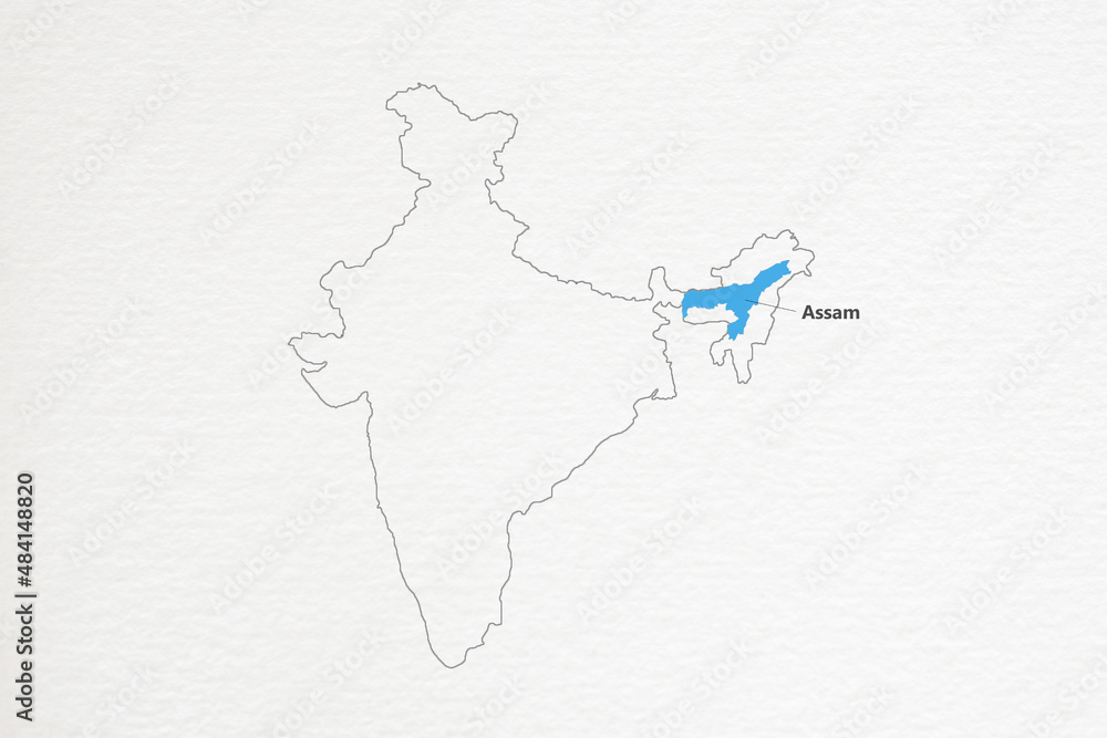 Assam state highlighted with blue color on Indian map on textured paper ...