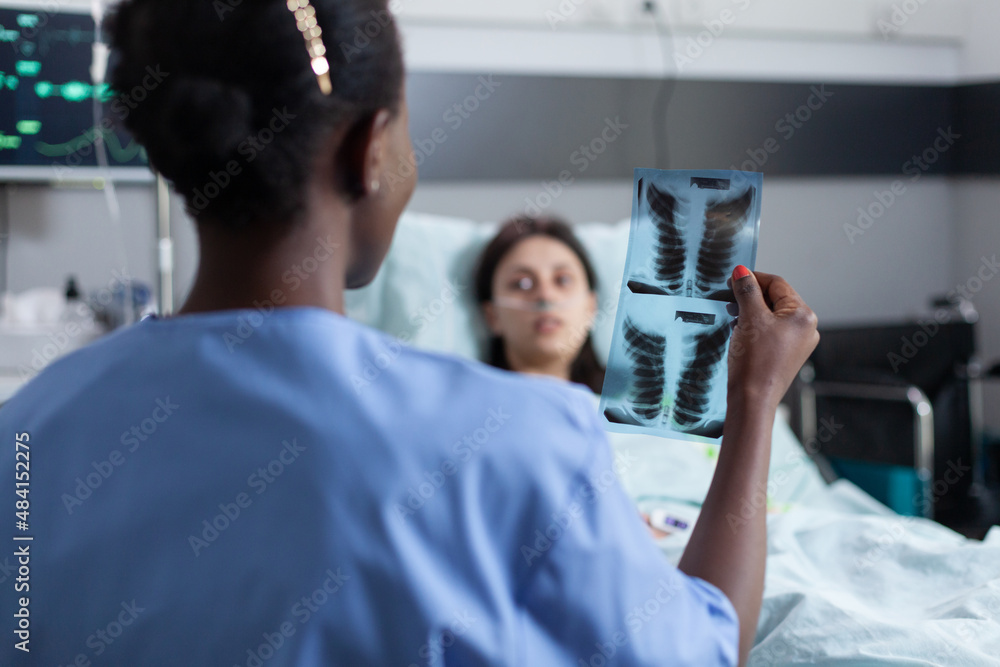 Professional nurse looking at chest xray pulmonary radiography ...
