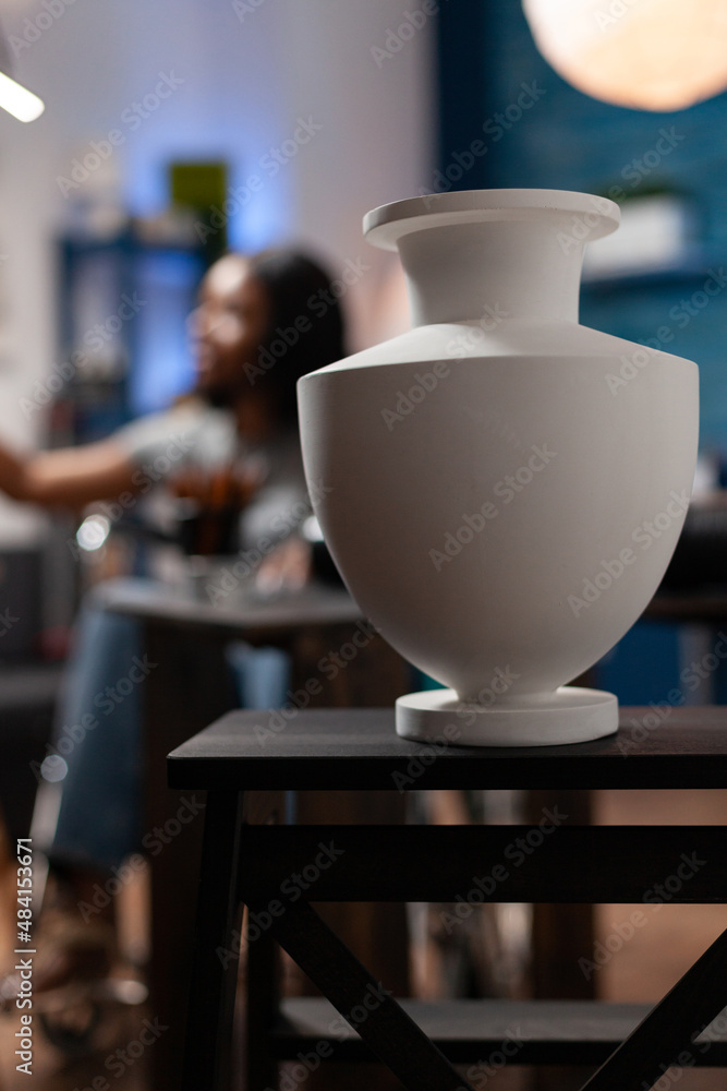 Selective focus on vase standing on table for artist inspiration in art ...