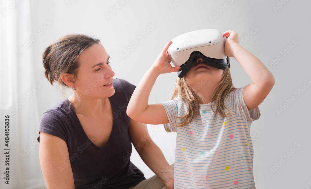 virtual reality. loving family spends time together. mom and Cute ...