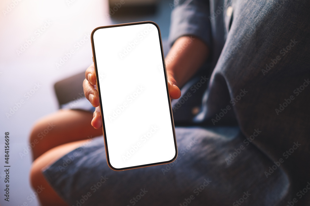 Mockup image of a woman with open hand holding and showing mobile phone ...