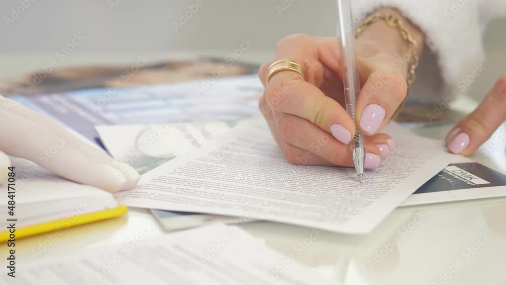 Cosmetologist dermatologist advises the patient before the procedure ...