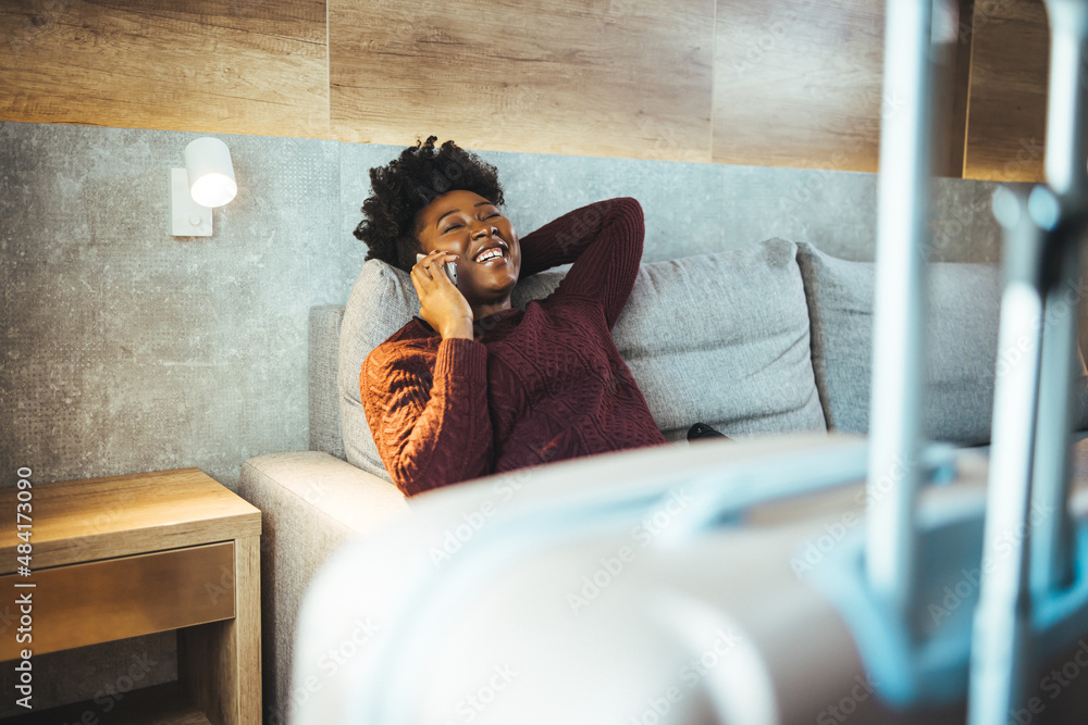 Confident businesswoman in casual wear having a phone call and smiling ...