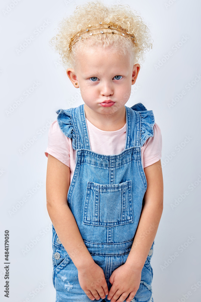 Serious pensive little kid girl looking unhappy at camera, tired upset ...