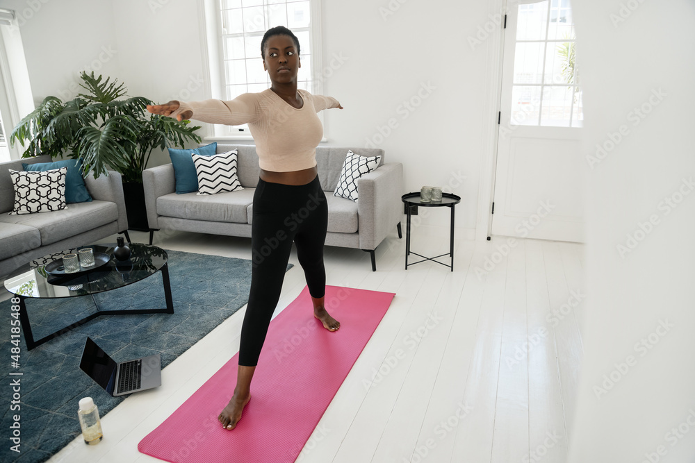 Black African woman stretched warrior yoga pose, fitness exercising at ...