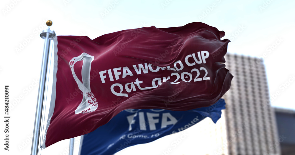 Flags with FIFA and Qatar 2022 World Cup logo waving in the wind Stock ...