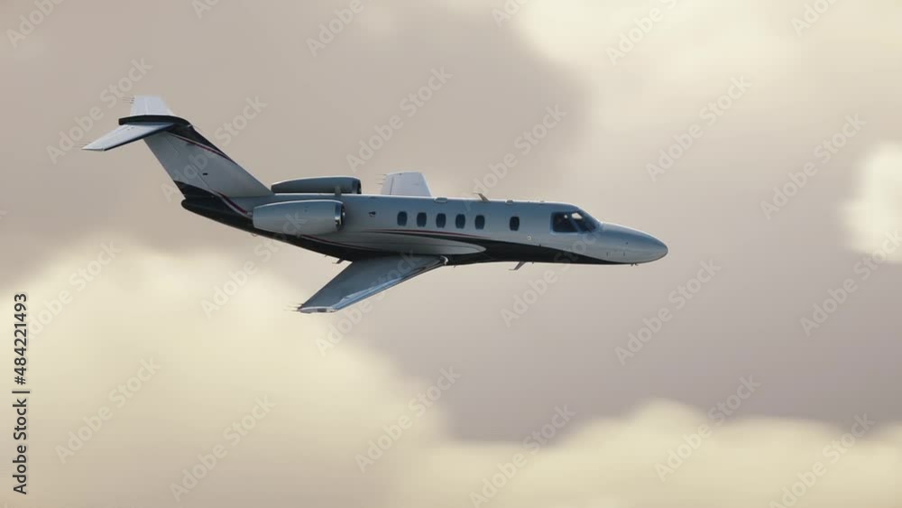 Side view of a private airplane flying fast above clouds. Aerial view ...