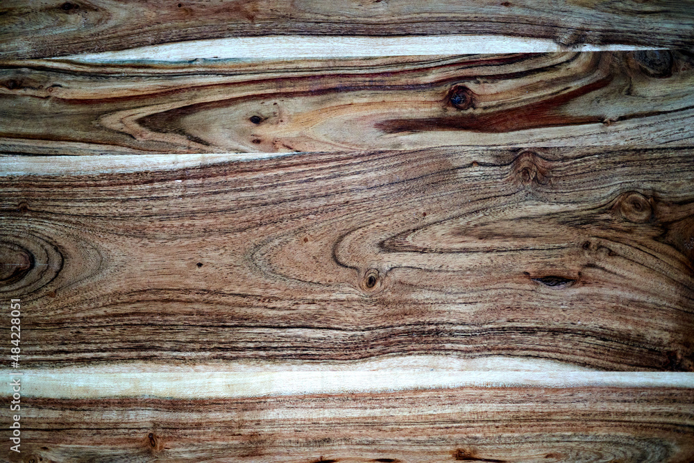 Beautiful wooden background made of cross-cut wood with a pattern of ...