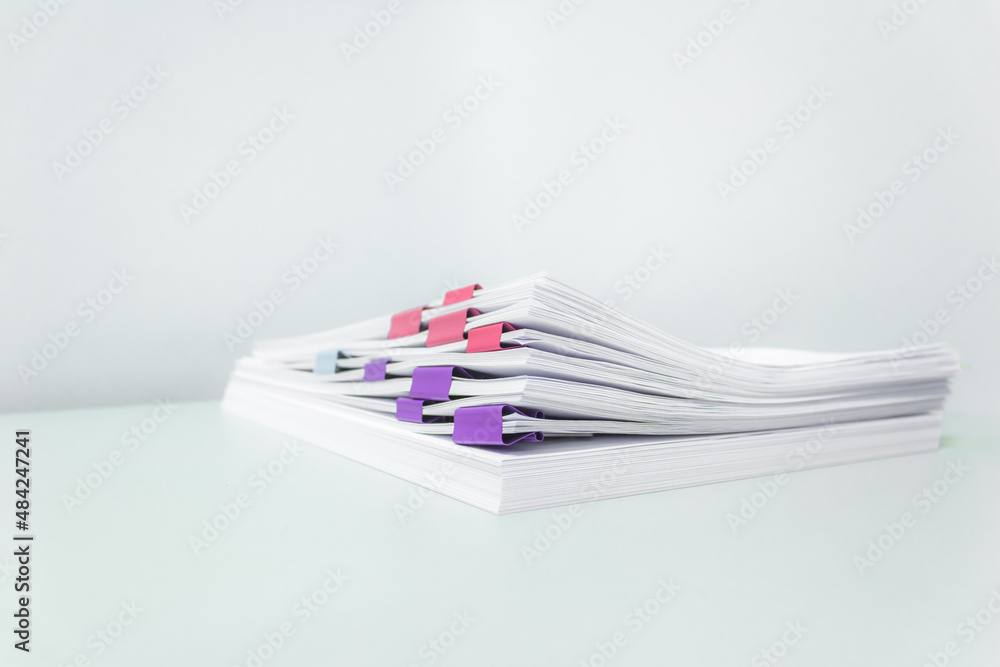 bundles bales of paper documents. stacks packs pile on the desk in the ...