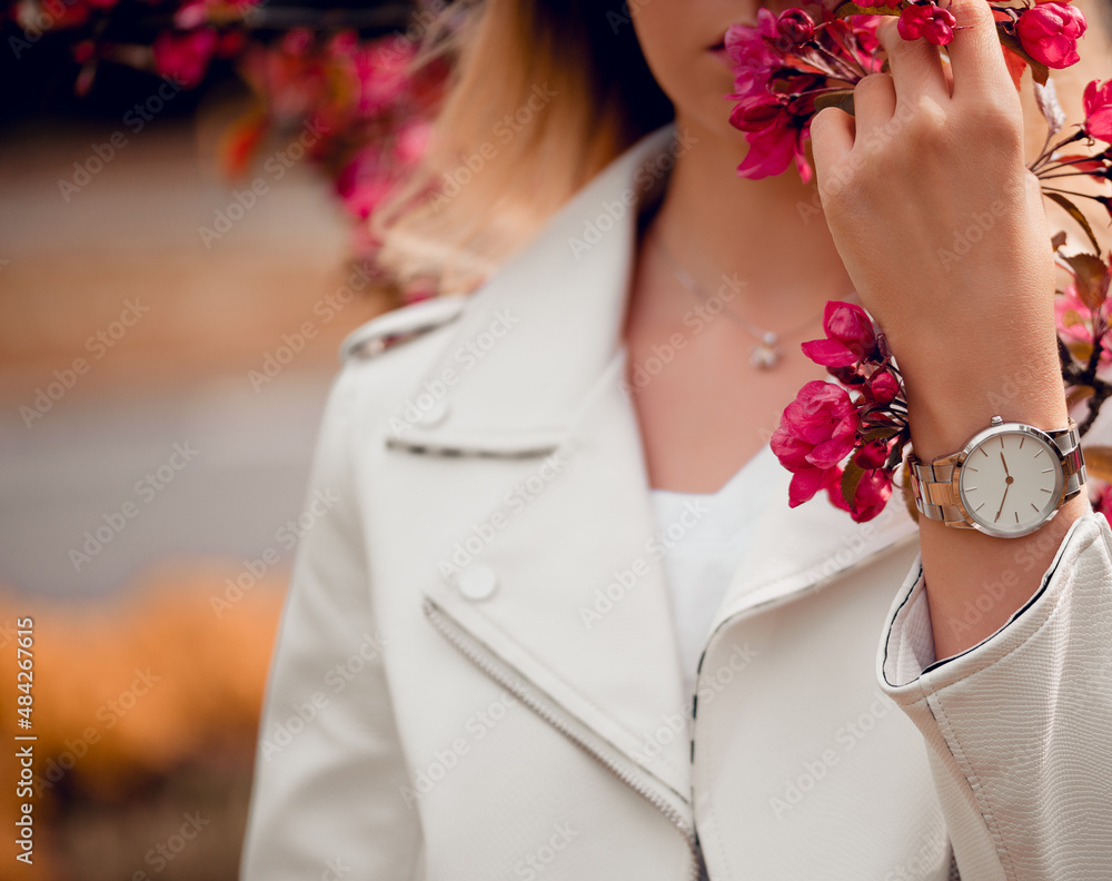 Beautiful classic white watch on woman hand. Stock Photo | Adobe Stock