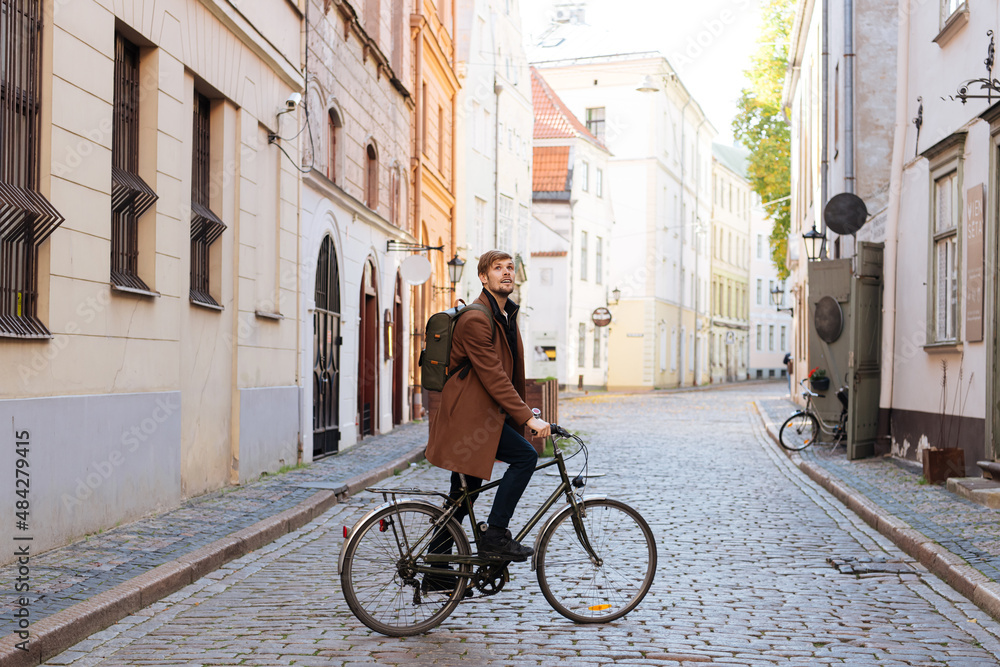 Young man riding a bike. Sustainable mobility transport New way of ...