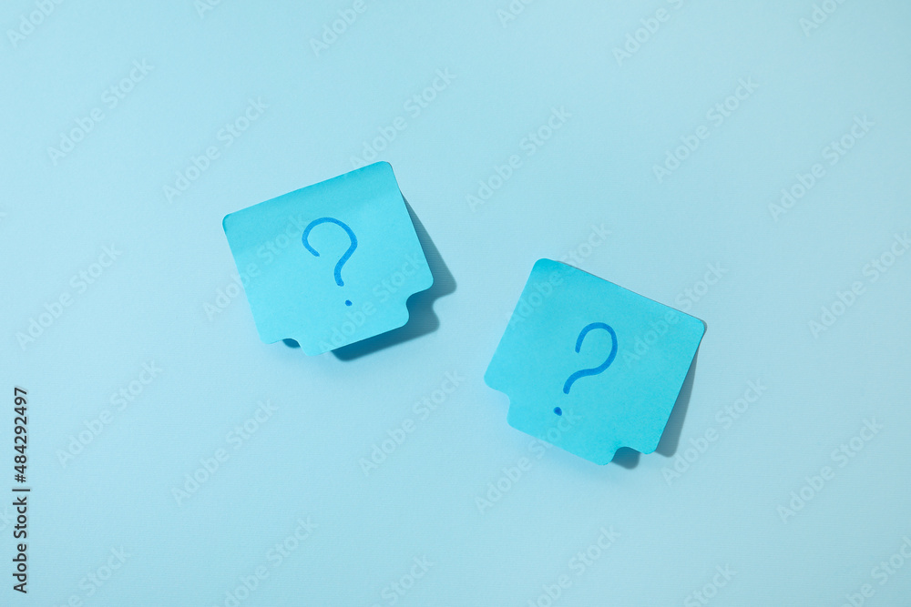 Sticky notes with question marks on blue background Stock Photo | Adobe ...