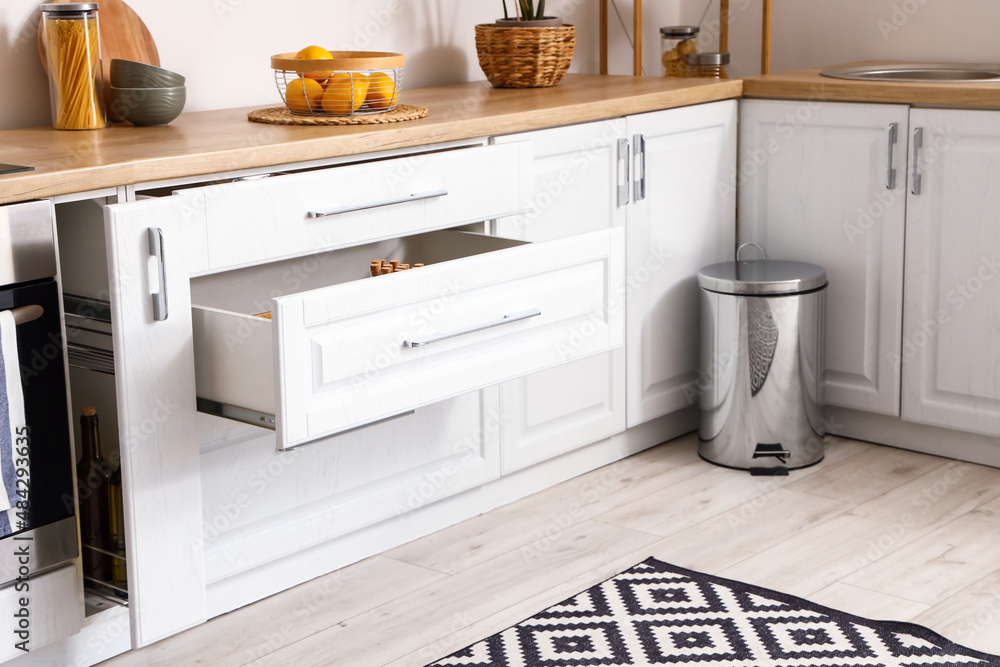 Opened drawers in modern kitchen interior Stock Photo | Adobe Stock