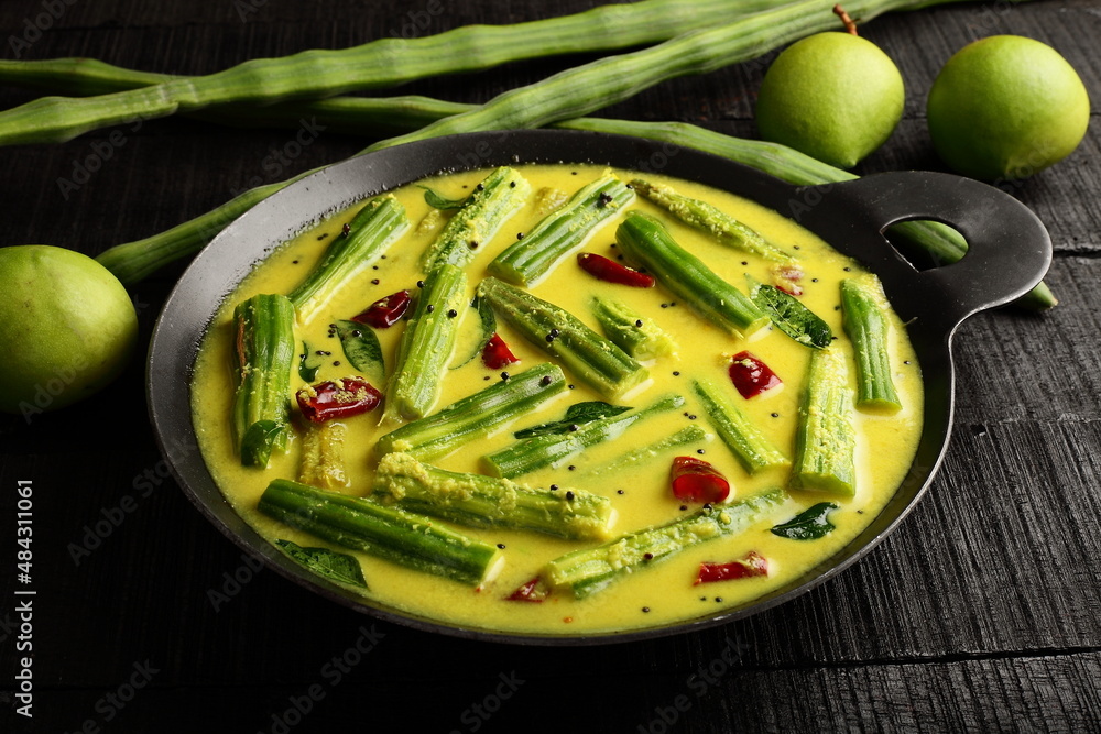 Moringa oleifera, muringa raw green mango curry. Kerala vegetarian ...