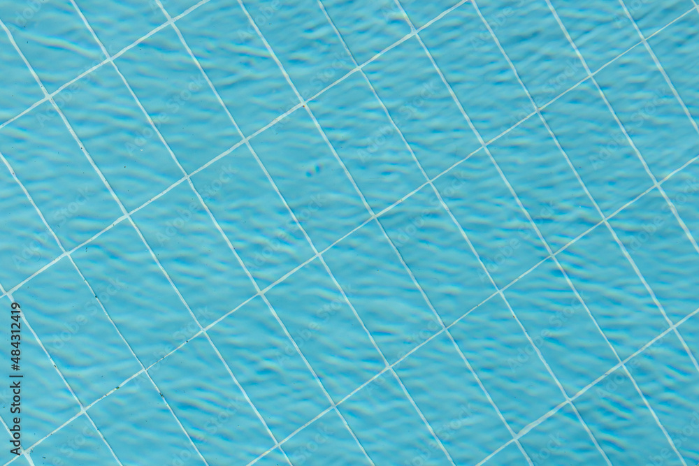 Beautiful texture of water with sun lights in a pool on the blue ...