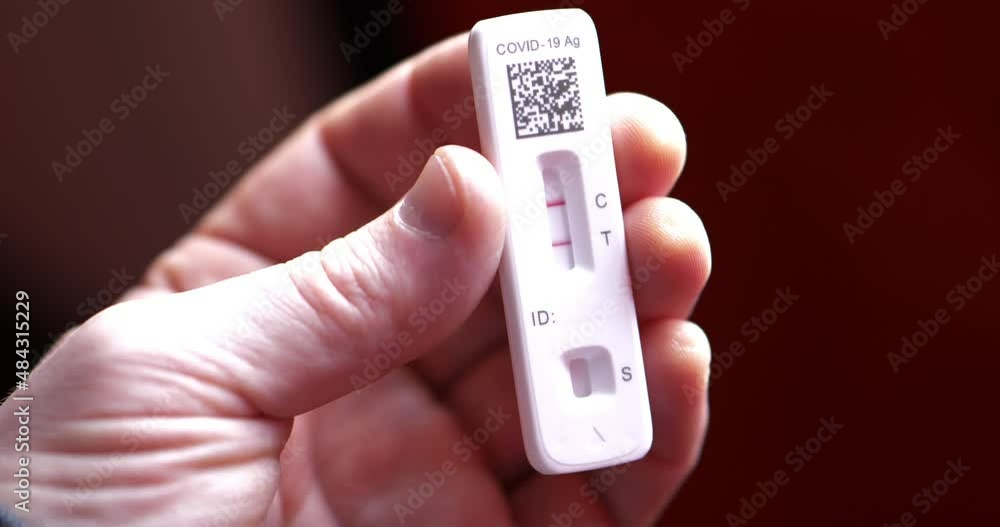 Covid 19 positive antigen test with two red lines control and test in ...