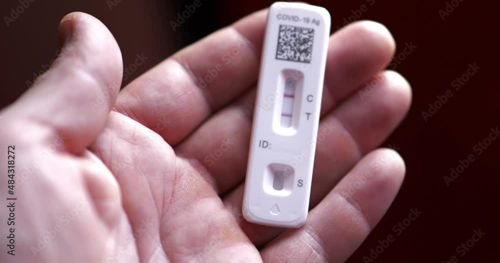 Covid 19 positive antigen test with two red lines control and test in ...
