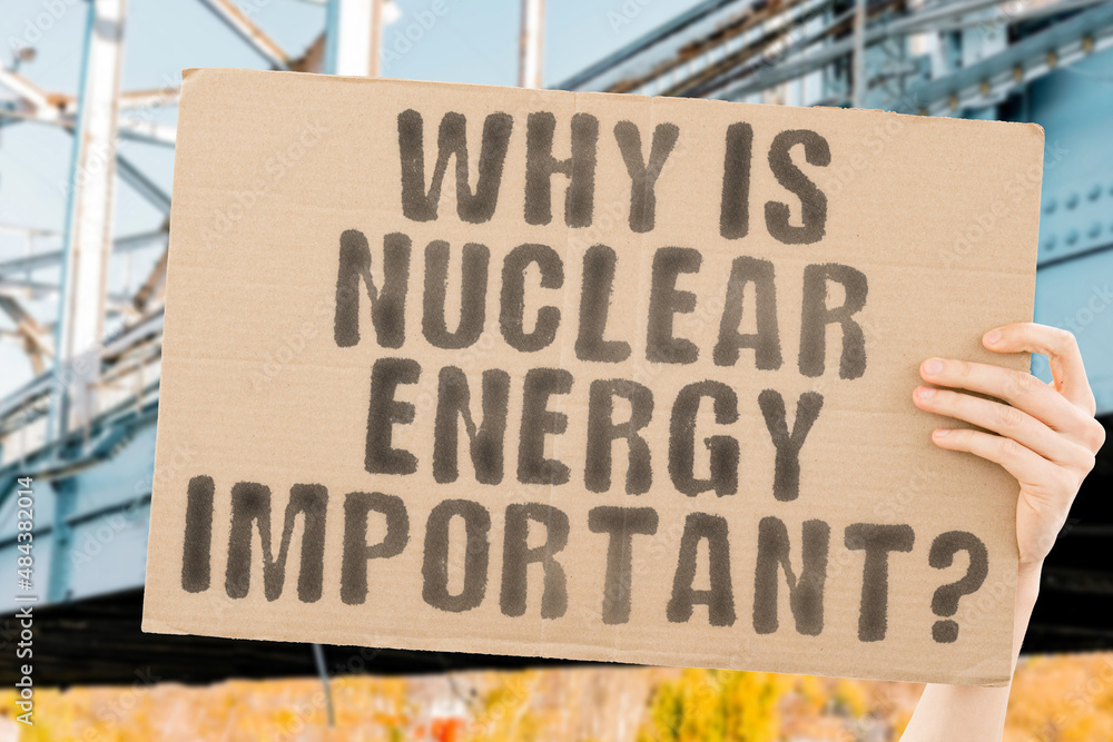 The question " Why is nuclear energy important? " on a banner in men's ...