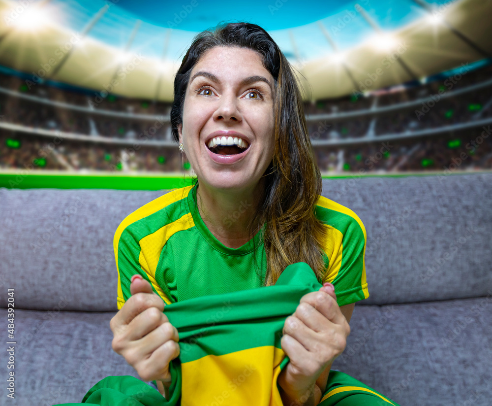 Beautiful fan of the Brazilian Soccer Team. Background stadium. Stock ...