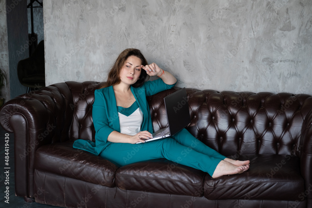 distant work, remote study. confident brunette woman in green suit ...