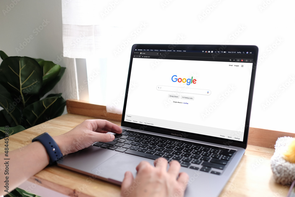 Bangkok. Thailand. FEB 3,2022 :A man is typing on Google search engine ...