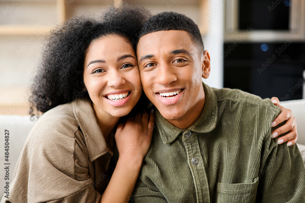 Happy together. Portrait of loving young husband and wife bonding to ...