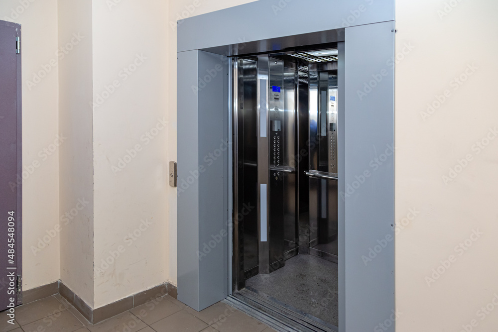 The elevator entrance is in modern office with marble wall. Lift ...