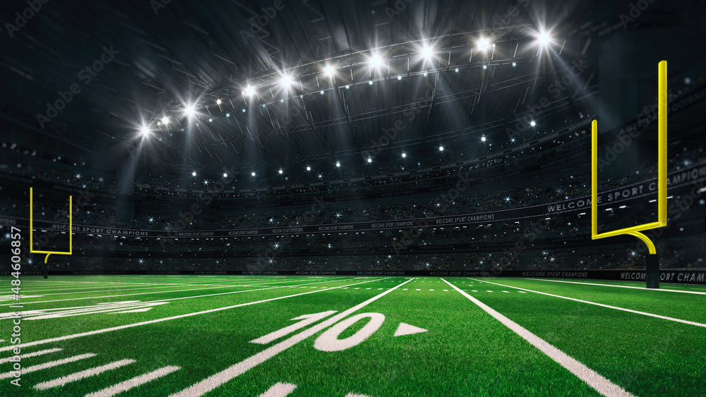American football stadium with yellow goal posts, grass field and fans ...