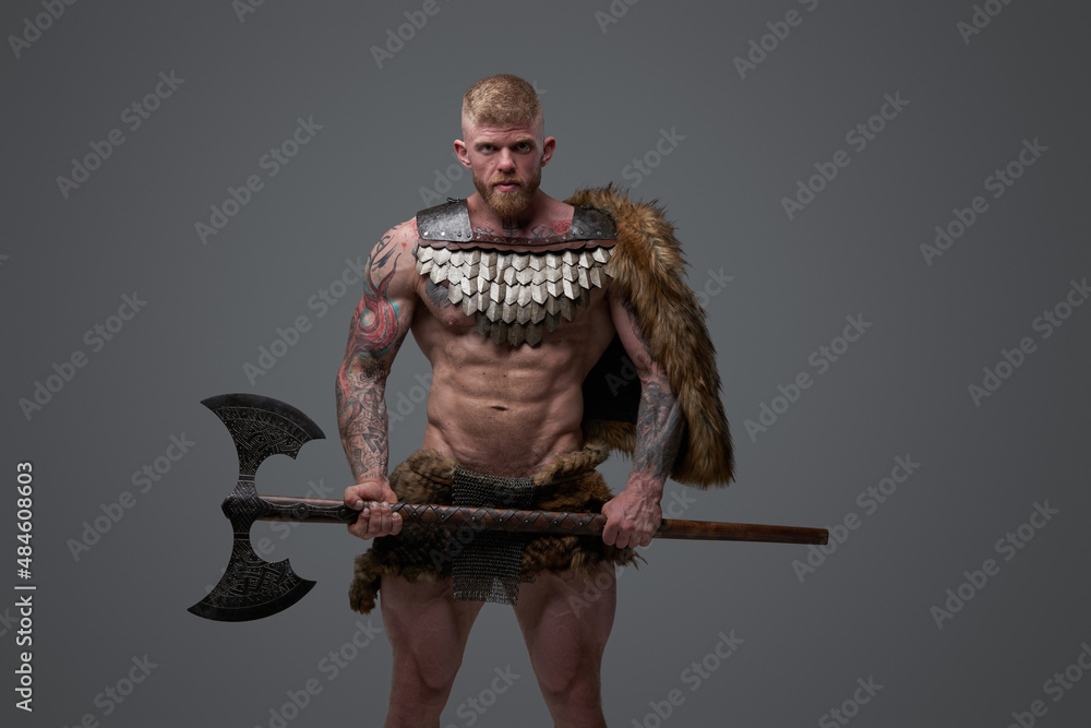 Strong viking fighter with fur holding two handed axe Stock Photo ...